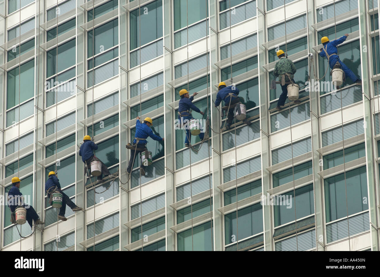 Chinese cleaners clean a new building located in financl street in ...