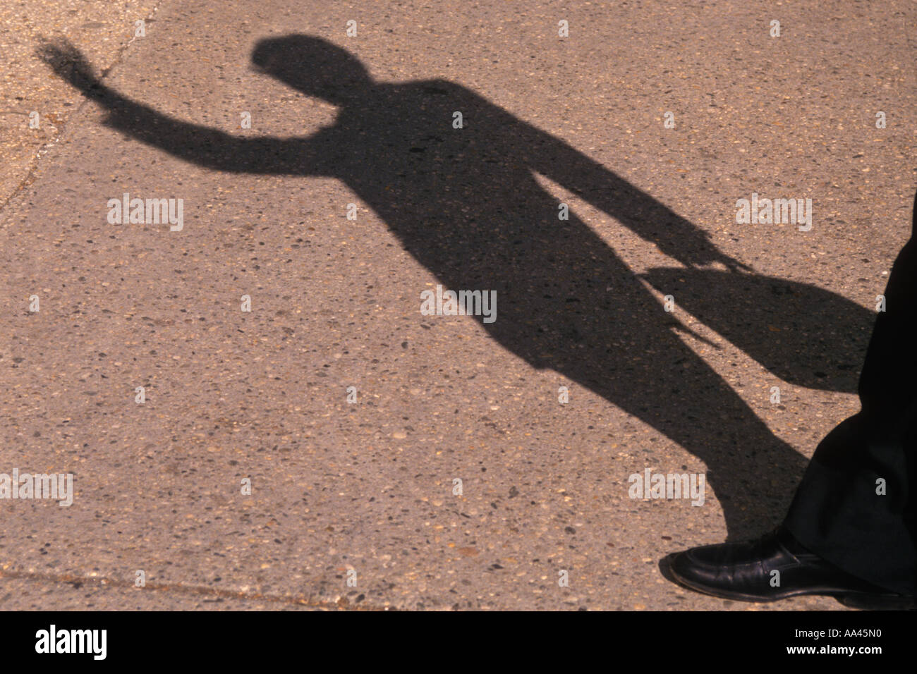 Shadow of a Businessman With a Briefcase Walking and Waving Stock Photo ...
