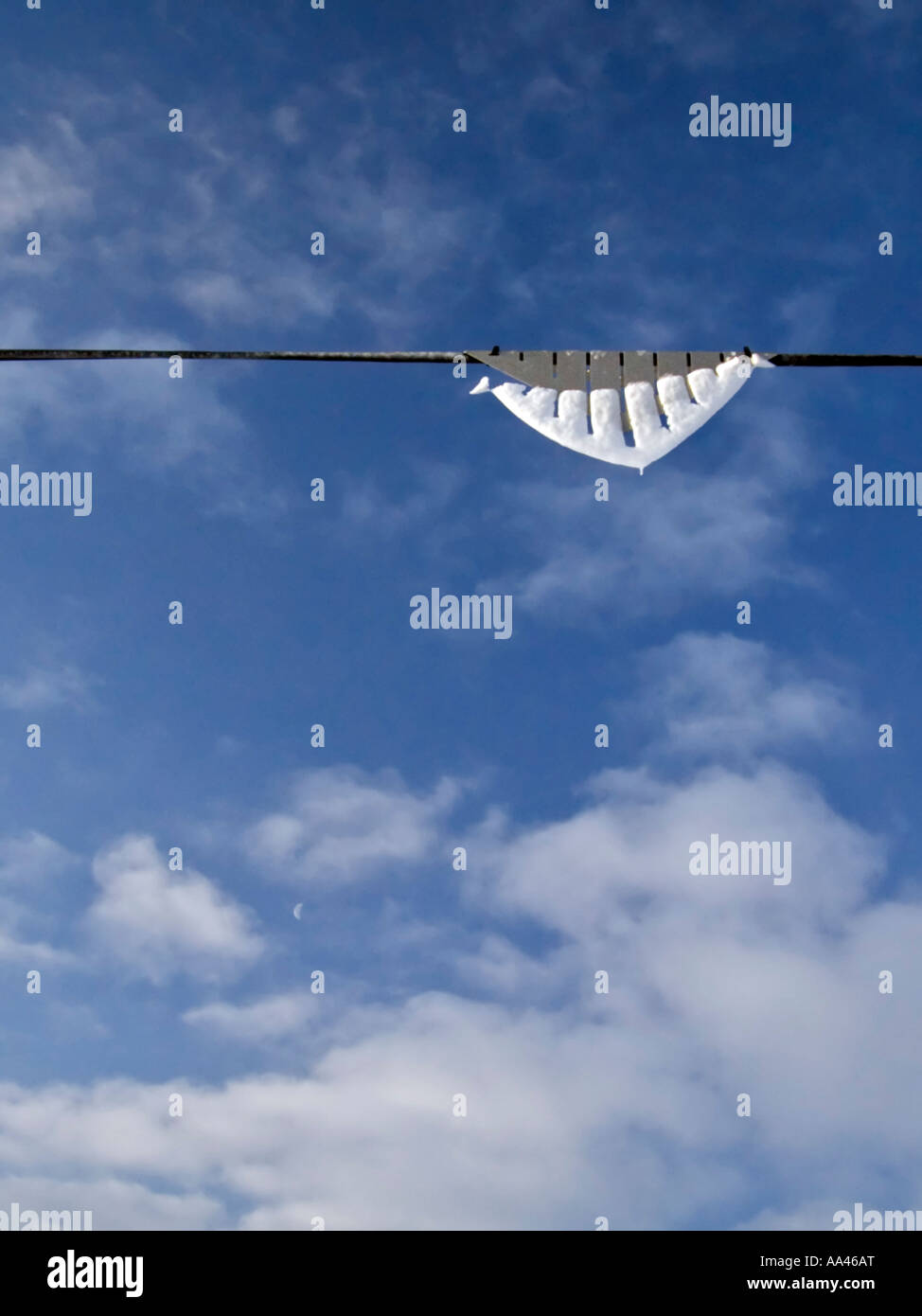 Powerline wind stabilizer with snow sliding off after a snowstorm in ...