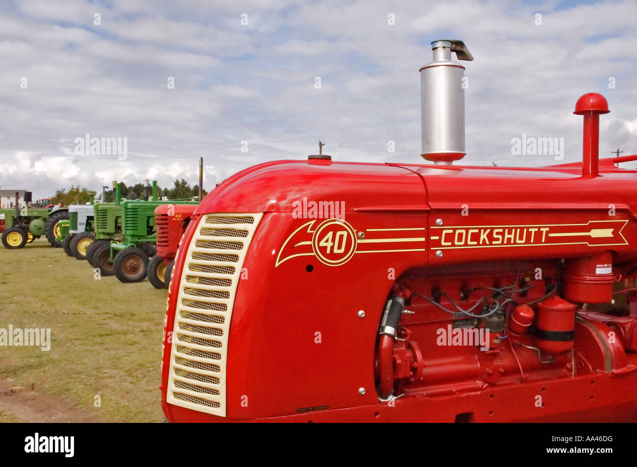 Vintage red Cockshutt tractor from passenger side view with other ...