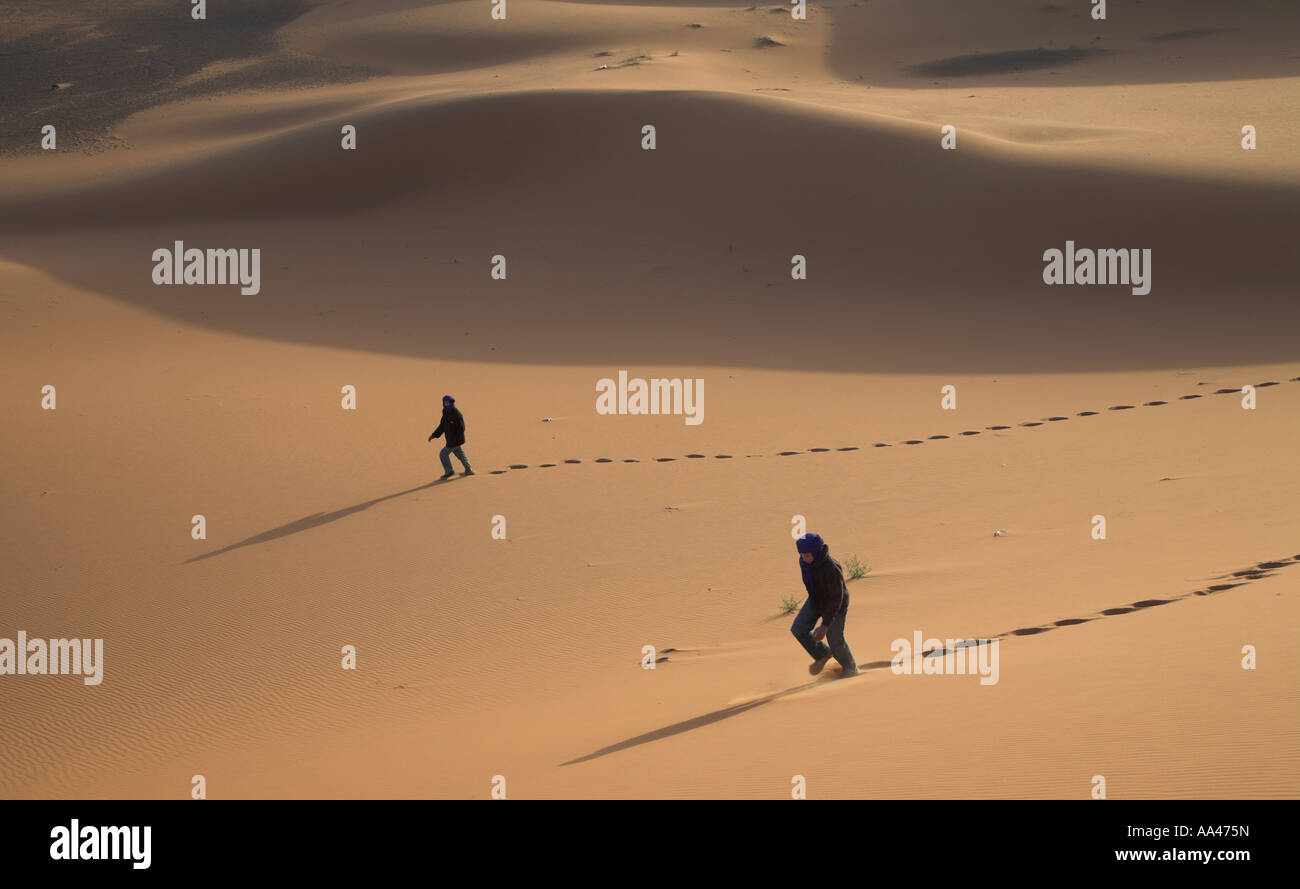 People running through sand sandy Sahara desert Merzouga, Morocco ...