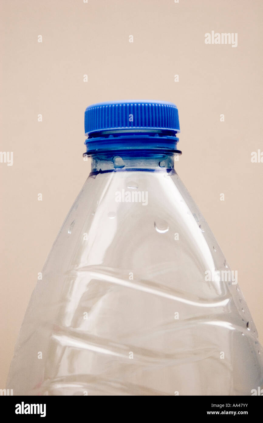 top half of a clear plastic water bottle blue top Stock Photo - Alamy