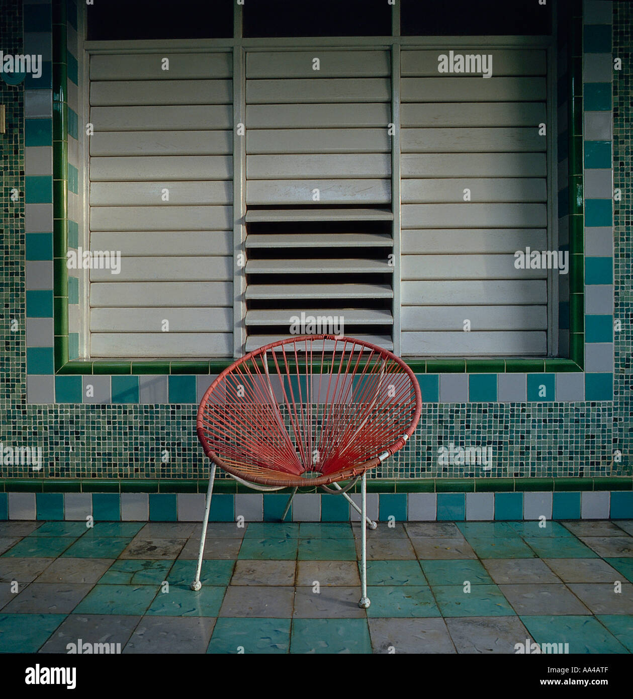 Plastic chair & tiles Stock Photo - Alamy