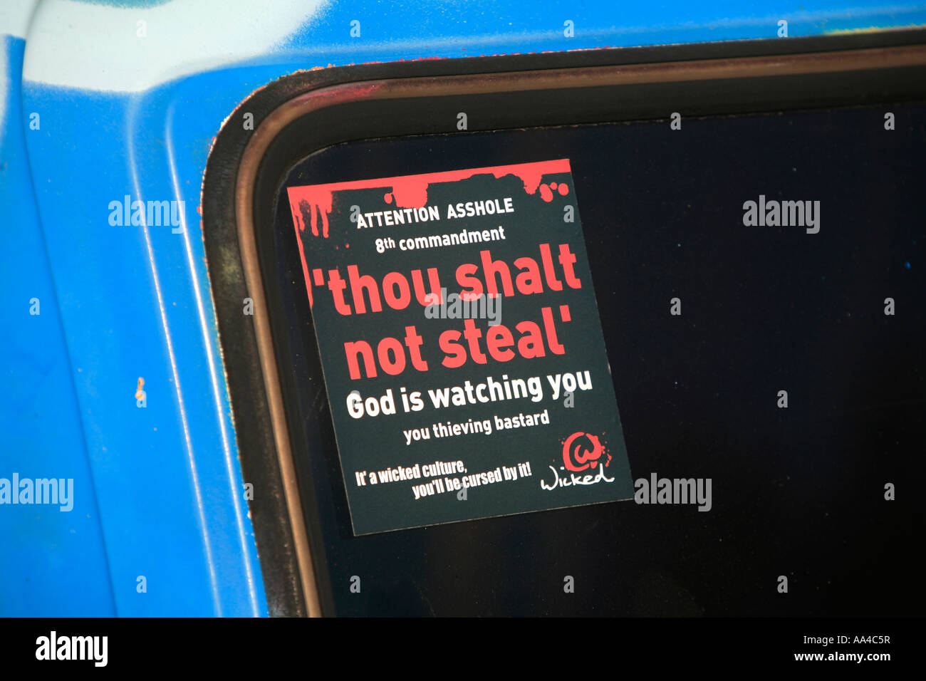 Thou shalt not steal sticker on motor vehicle Stock Photo - Alamy