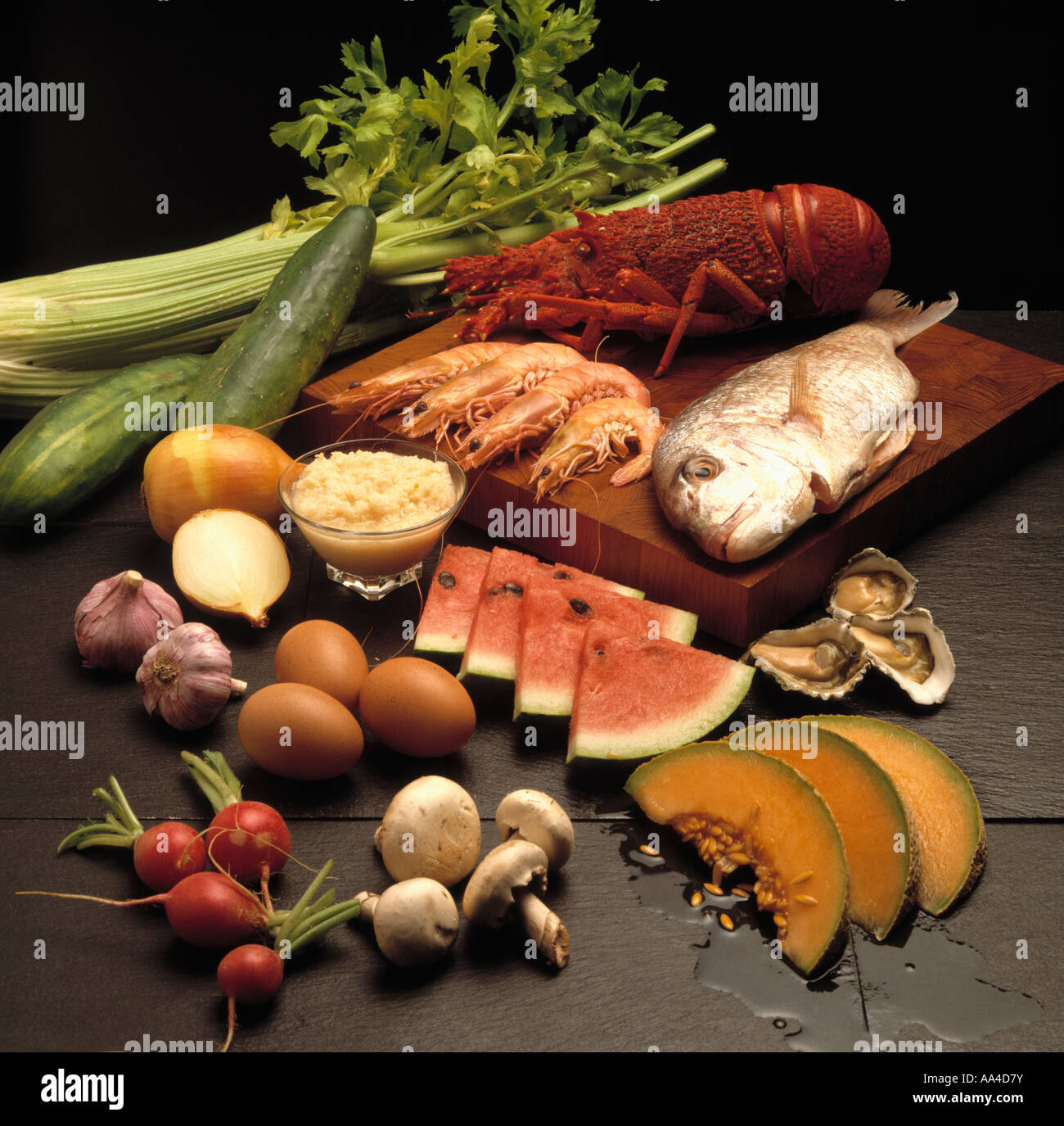 Selection of raw seafood and vegetables with celery and melon Stock ...