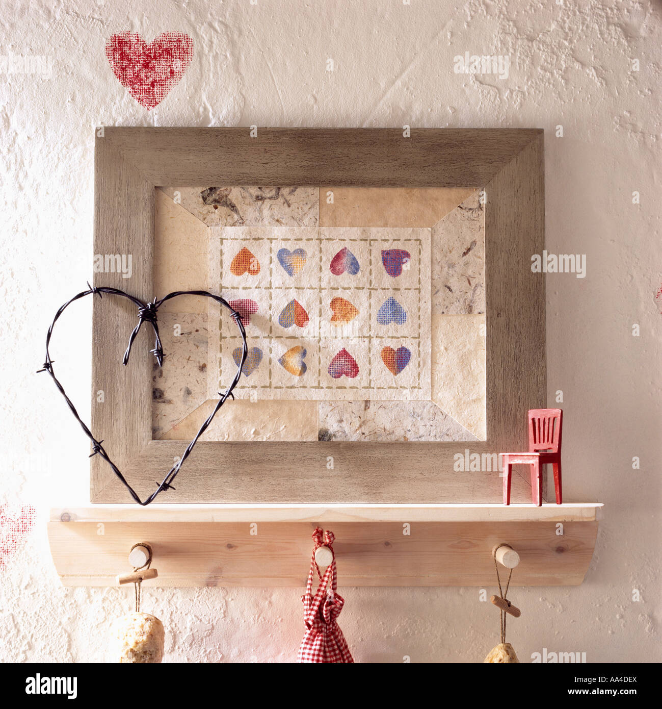 Wirework heart and heart stencils in wooden frame on wooden shelf Stock ...