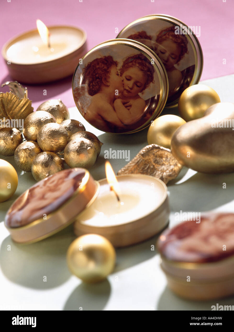 Circular candle tins with cherub motif Stock Photo - Alamy
