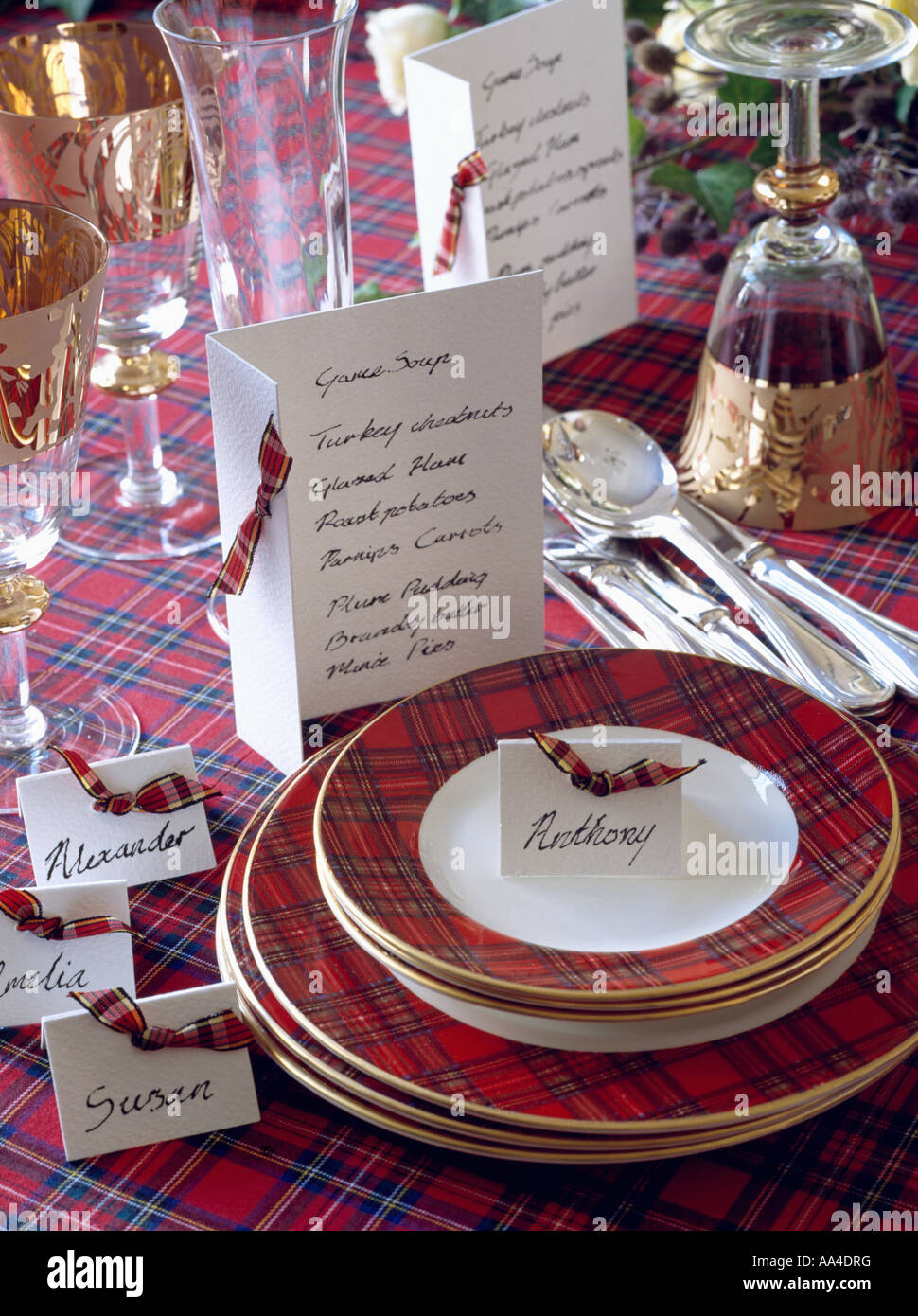 Menu and placecards on dining table with red tartan plates Stock Photo ...