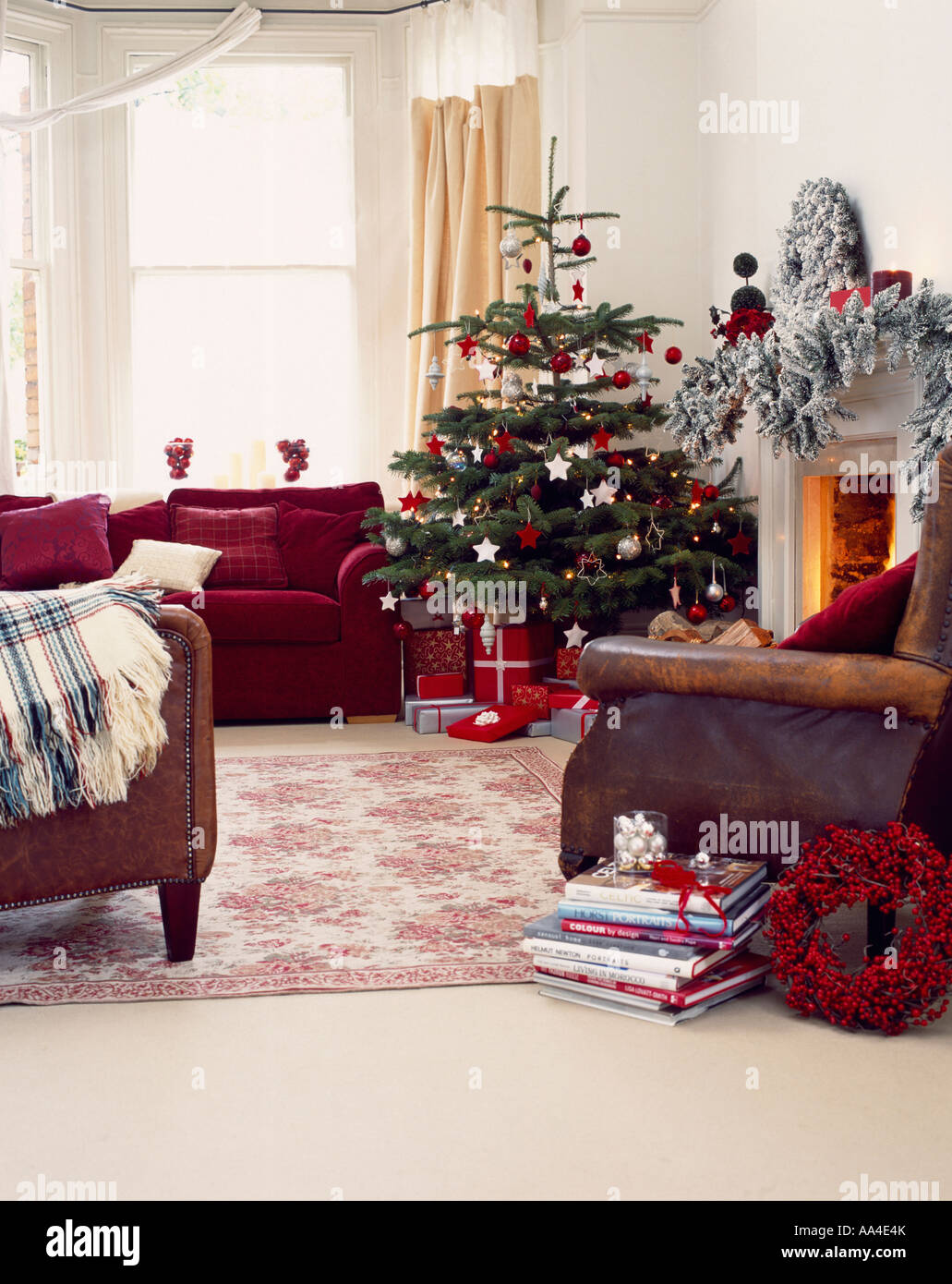 Christmas tree in corner of livingroom and silver conifer garland on ...