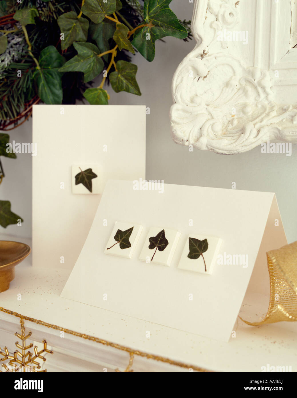 Handmade Christmas cards with ivy leaf collage on white paper Stock ...