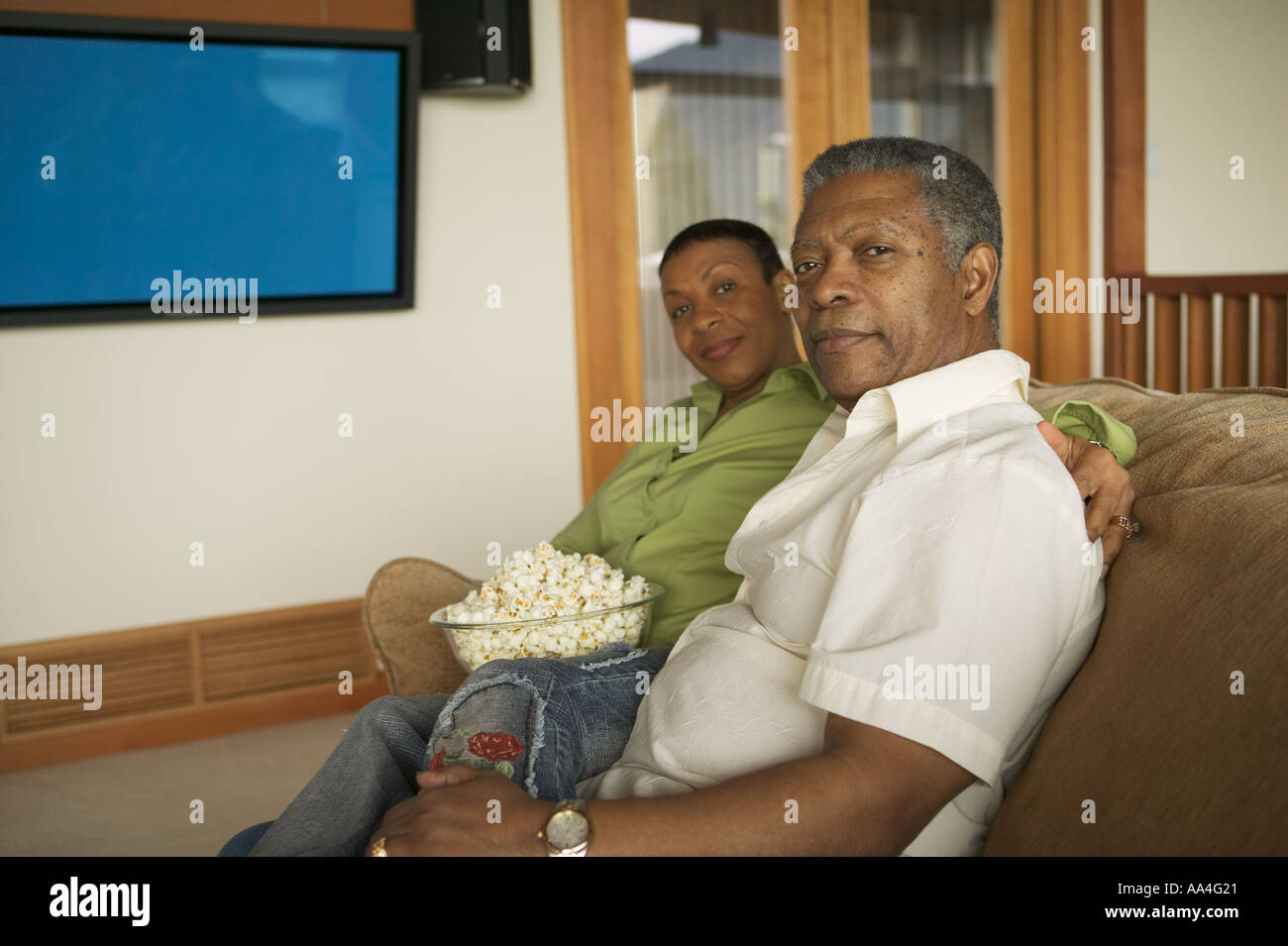 Seniors African Americans Watching plasma TV Stock Photo - Alamy