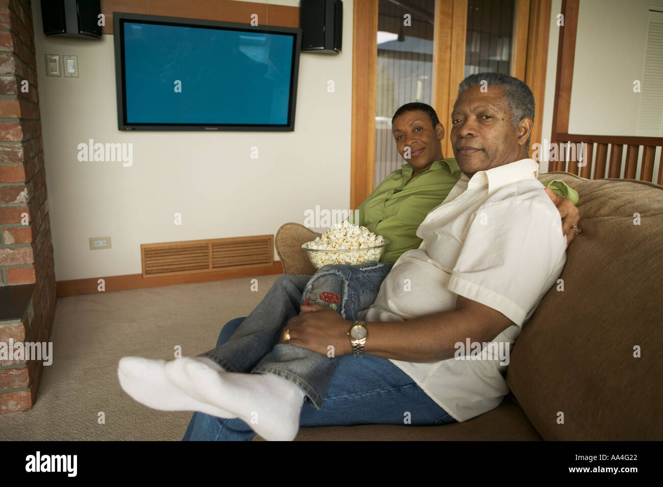 Seniors African Americans Watching plasma TV Stock Photo - Alamy