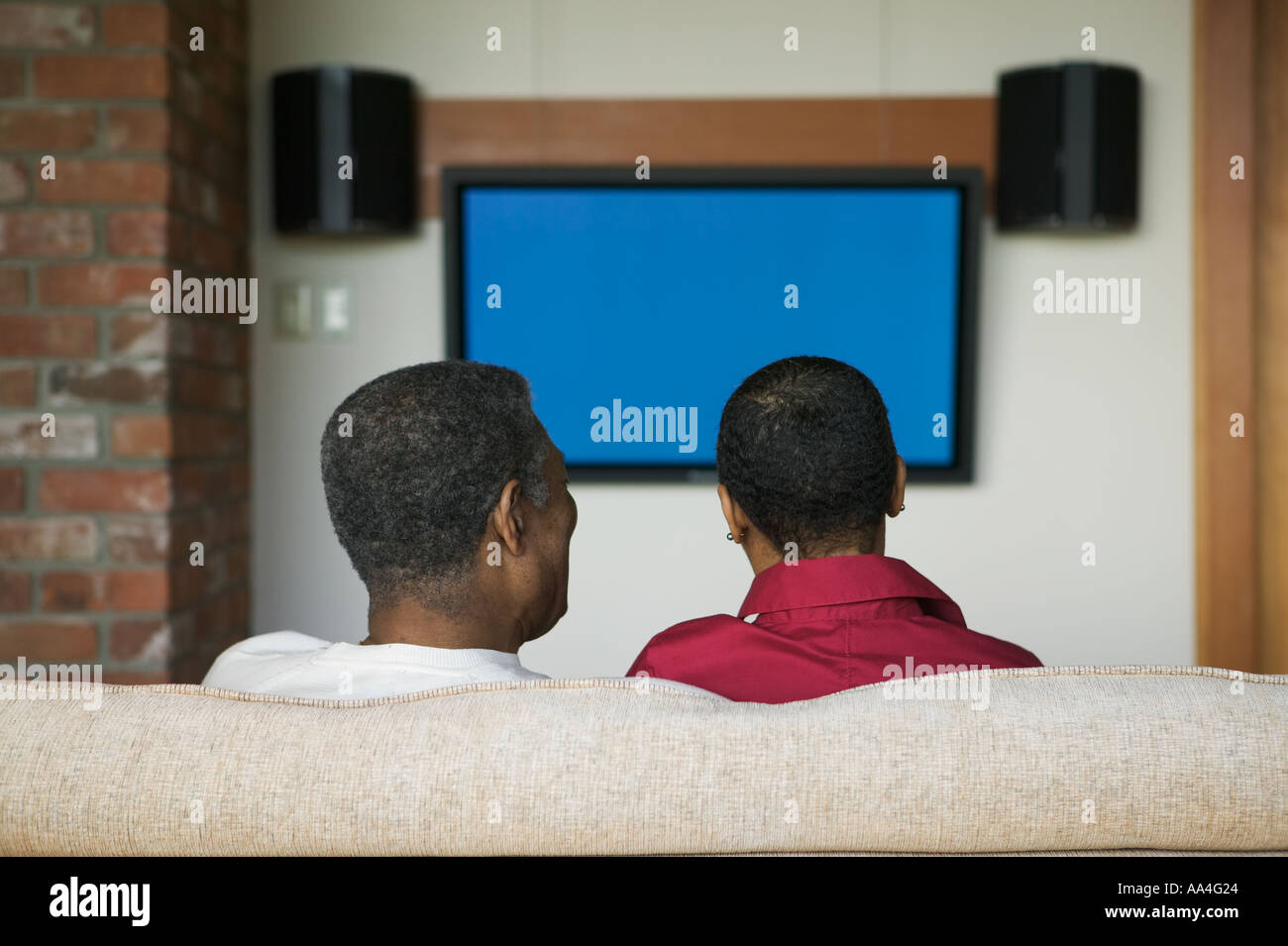 Seniors African Americans Watching plasma TV Stock Photo - Alamy