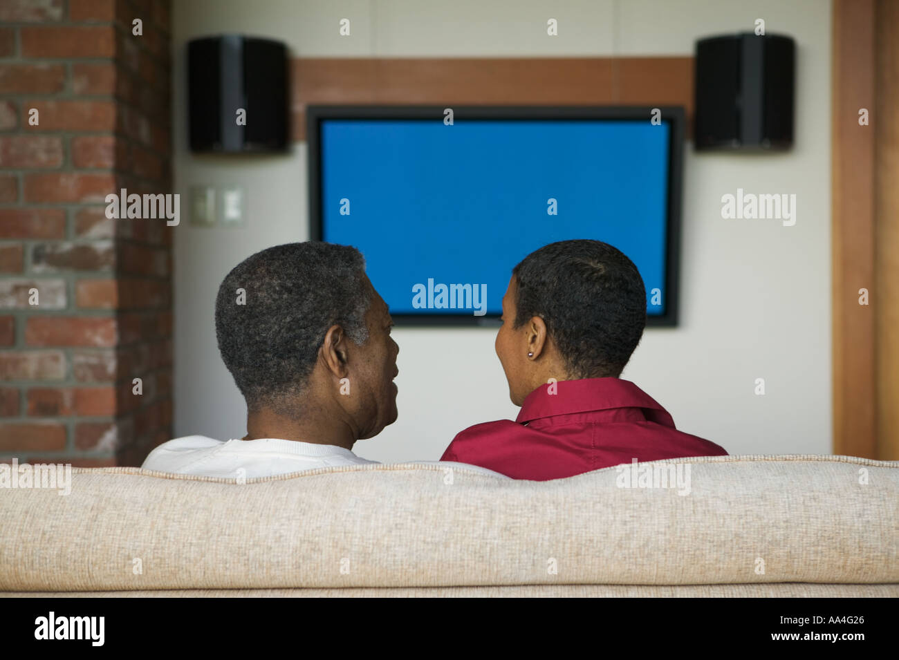 Seniors African Americans Watching plasma TV Stock Photo - Alamy