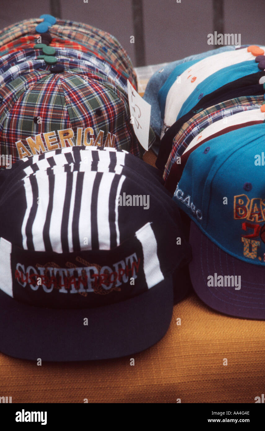 Baseball caps stacked for sale on a market stall Stock Photo - Alamy