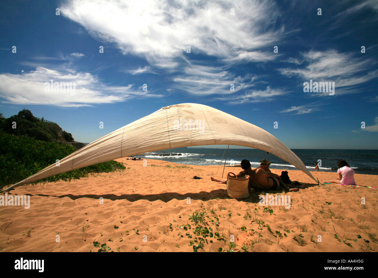 Shade and shelter from solar radiation is provided by an old sail ...