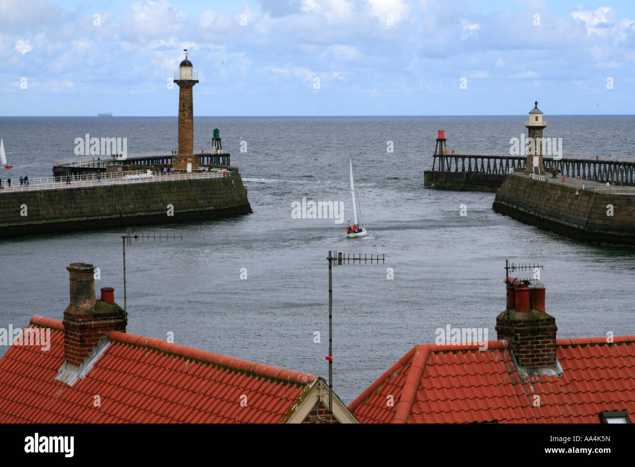 whitby harbour breakwater entrance over roof tops north yorkshire ...