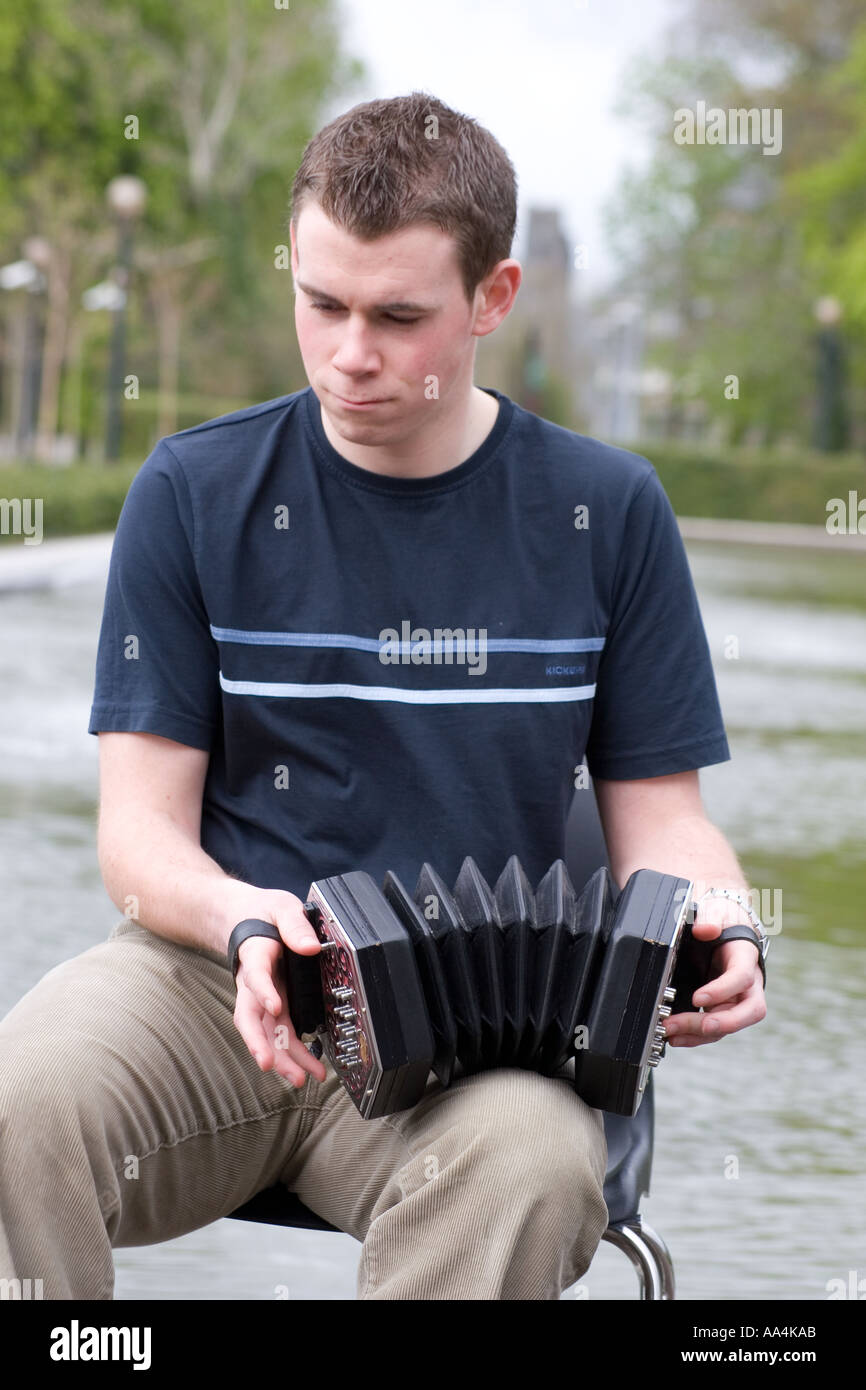 Playing concertina hi-res stock photography and images - Alamy