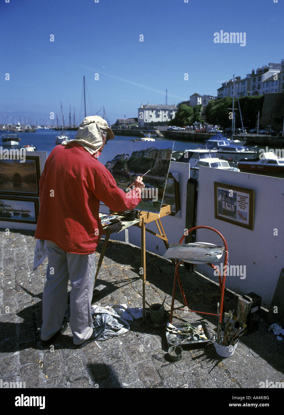 Brixham harbour artist, Devon England UK Stock Photo - Alamy