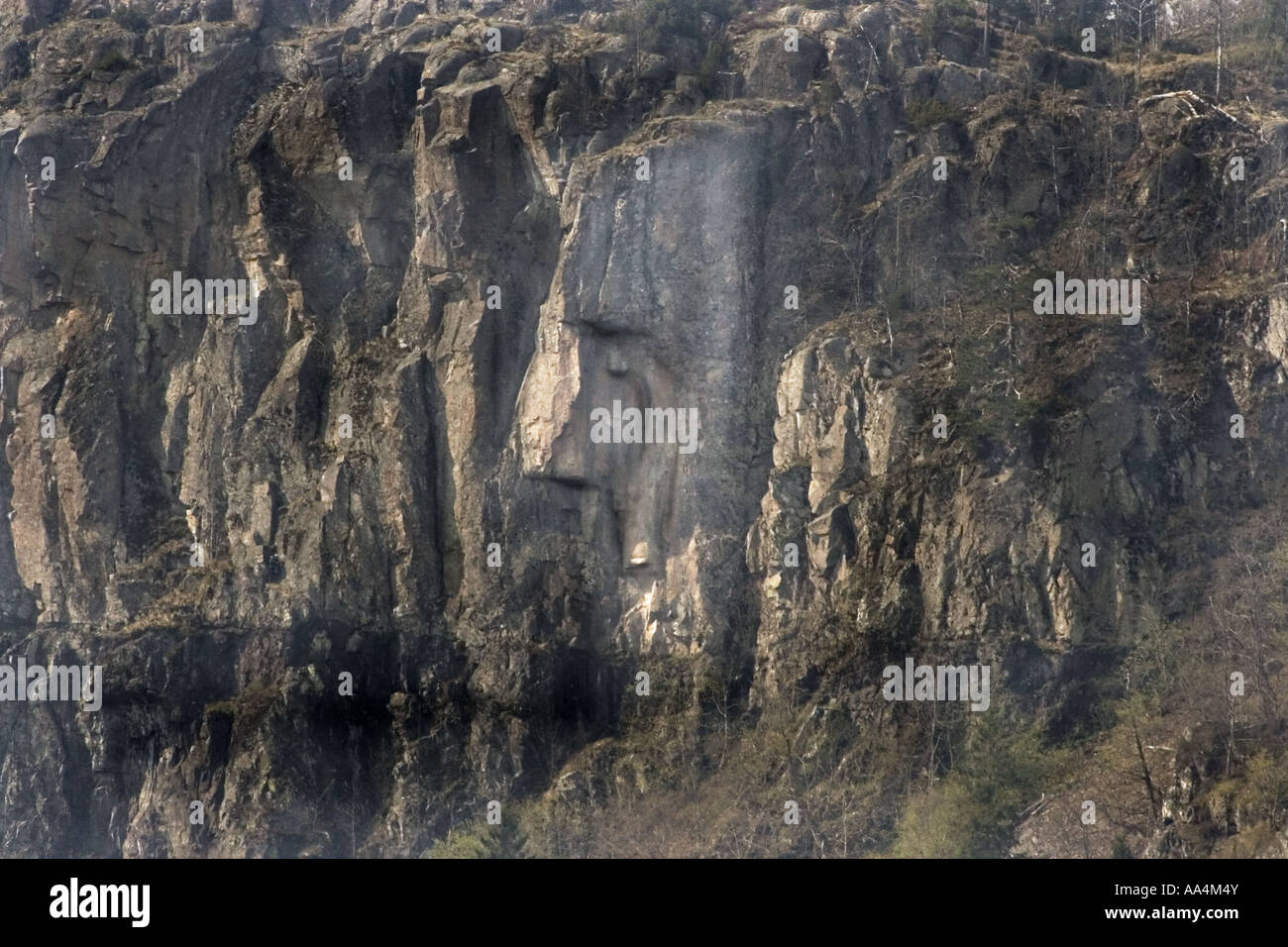 structure resembling a face on a rock, not man-made Stock Photo - Alamy