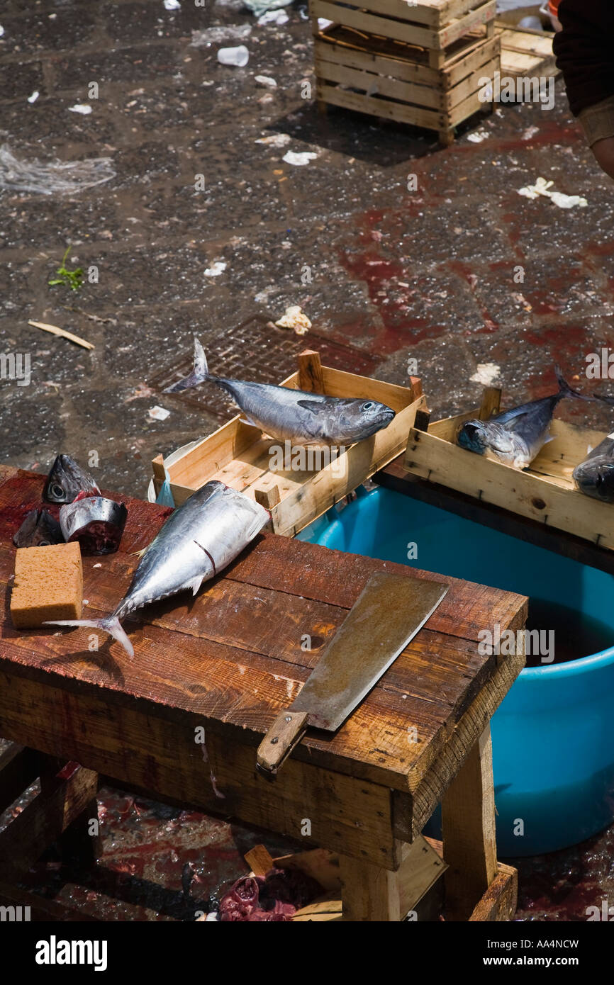 Chopping block with knife and fish head at outdoor fish market Catania ...