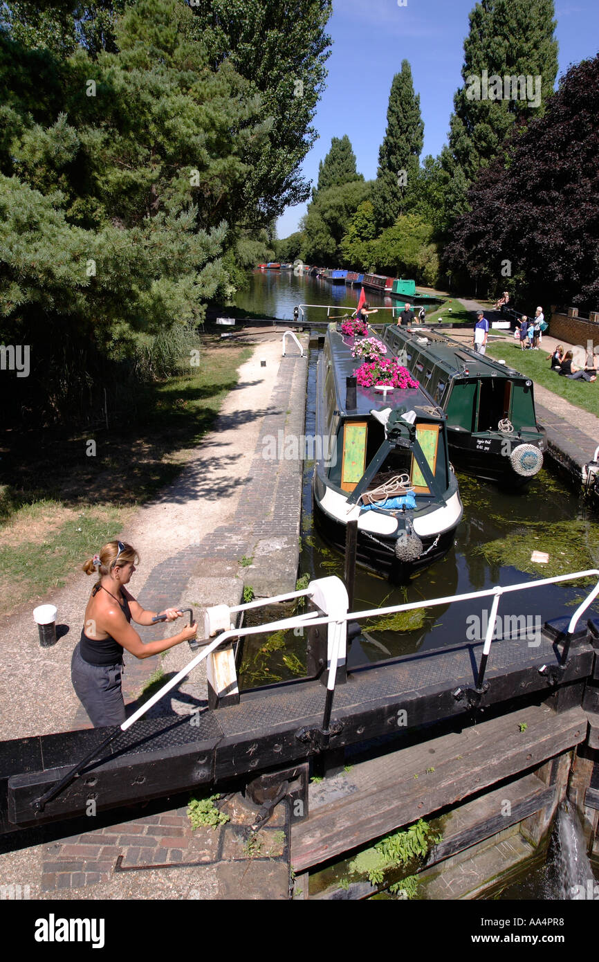 Woman opening a lock on Grand Union Canal UK Stock Photo - Alamy