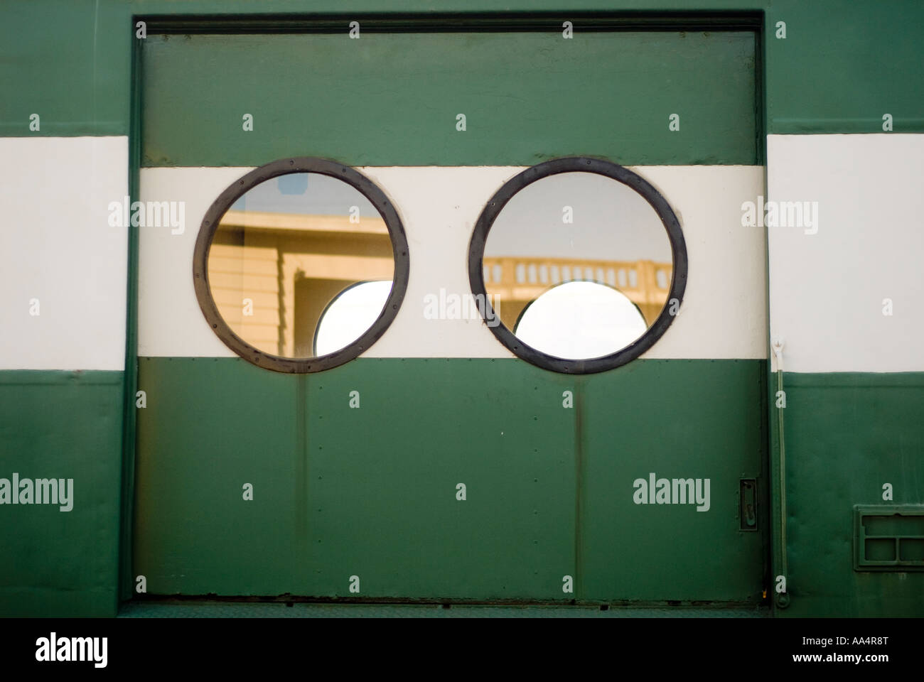 Round windows on side of old train Stock Photo - Alamy