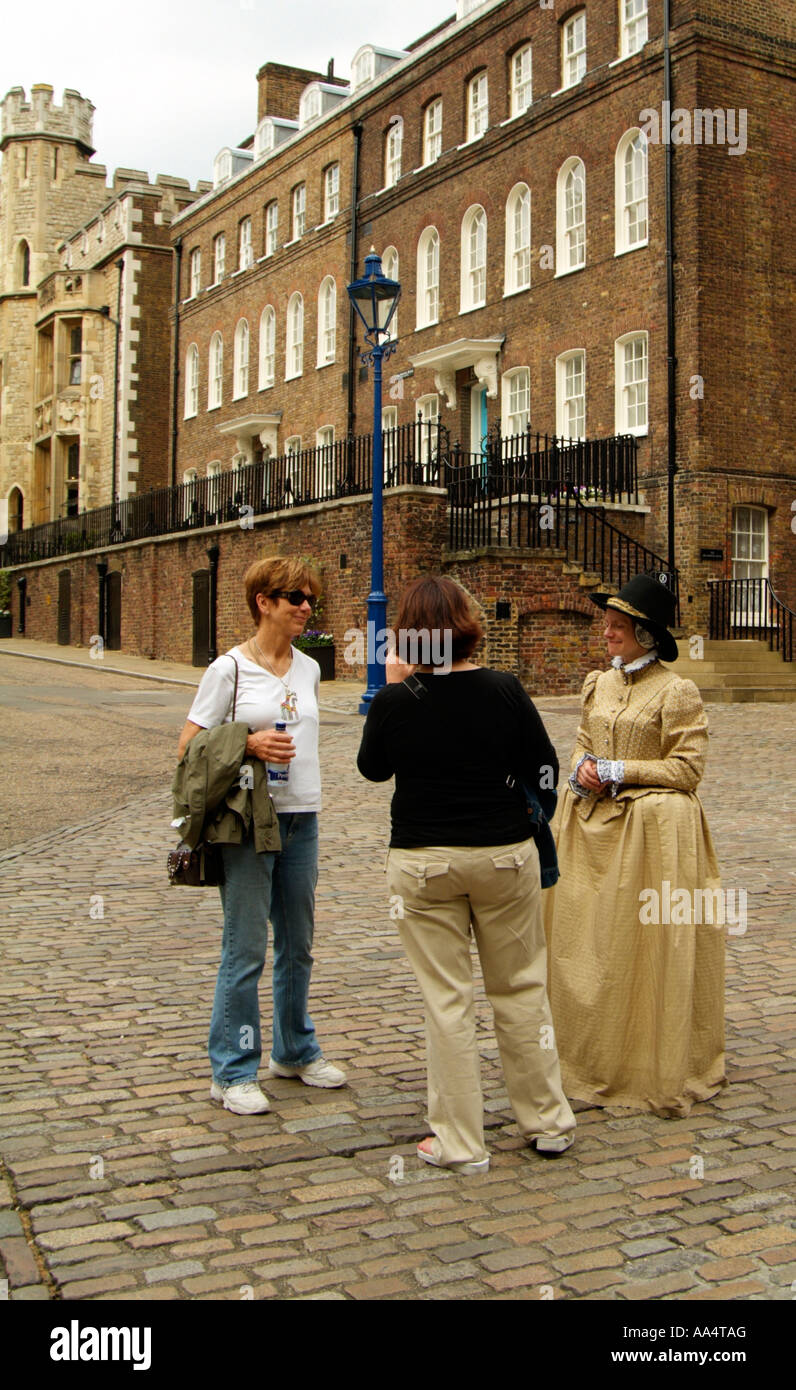 Visitors to Tower of London with costumed guide England UK Stock Photo ...