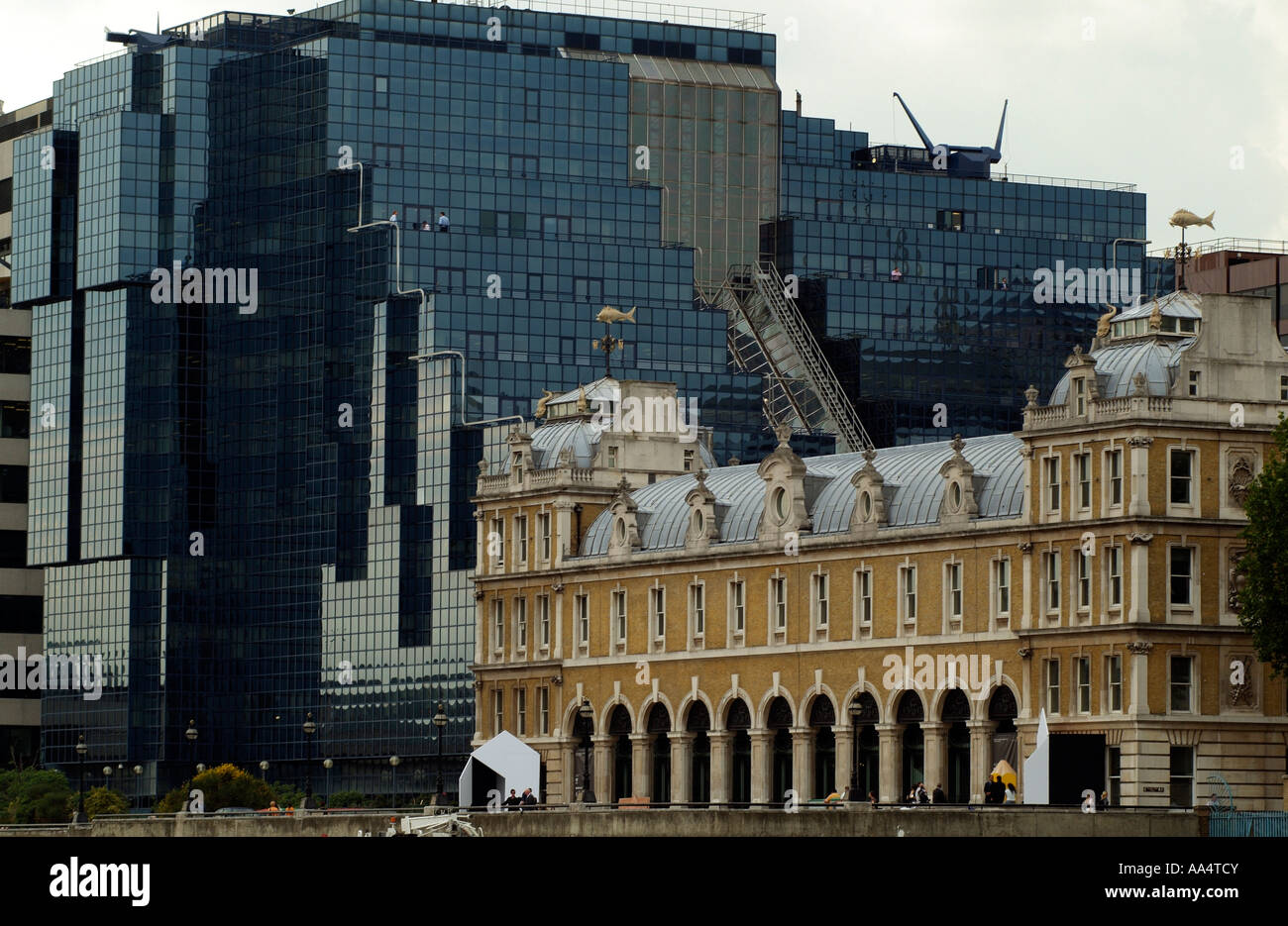 Modern glass office block and the old Billingsgate Fish Market building ...