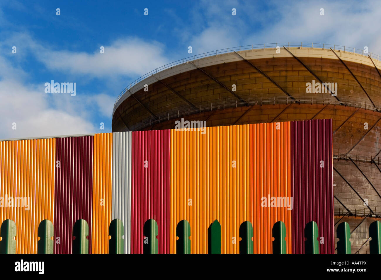 Red yellow and orange stripes on a warehouse building in front of a ...