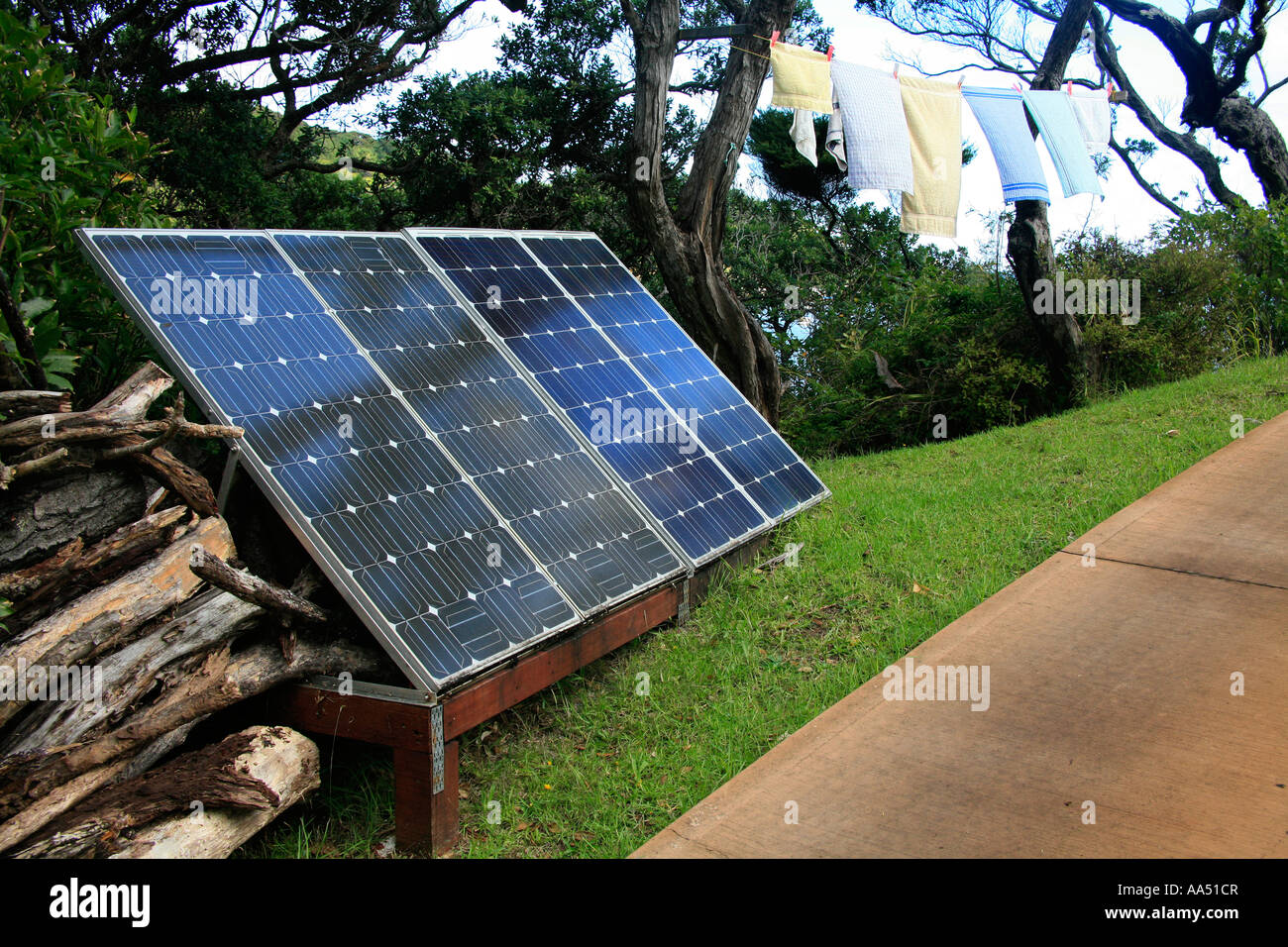 Solar panels with firewood and clothes drying on a clothesline Stock ...