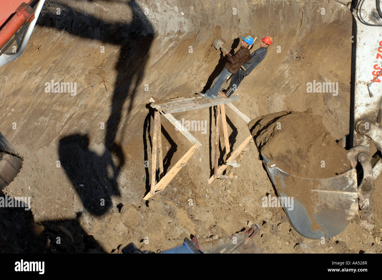 lorry and excavator Stock Photo - Alamy