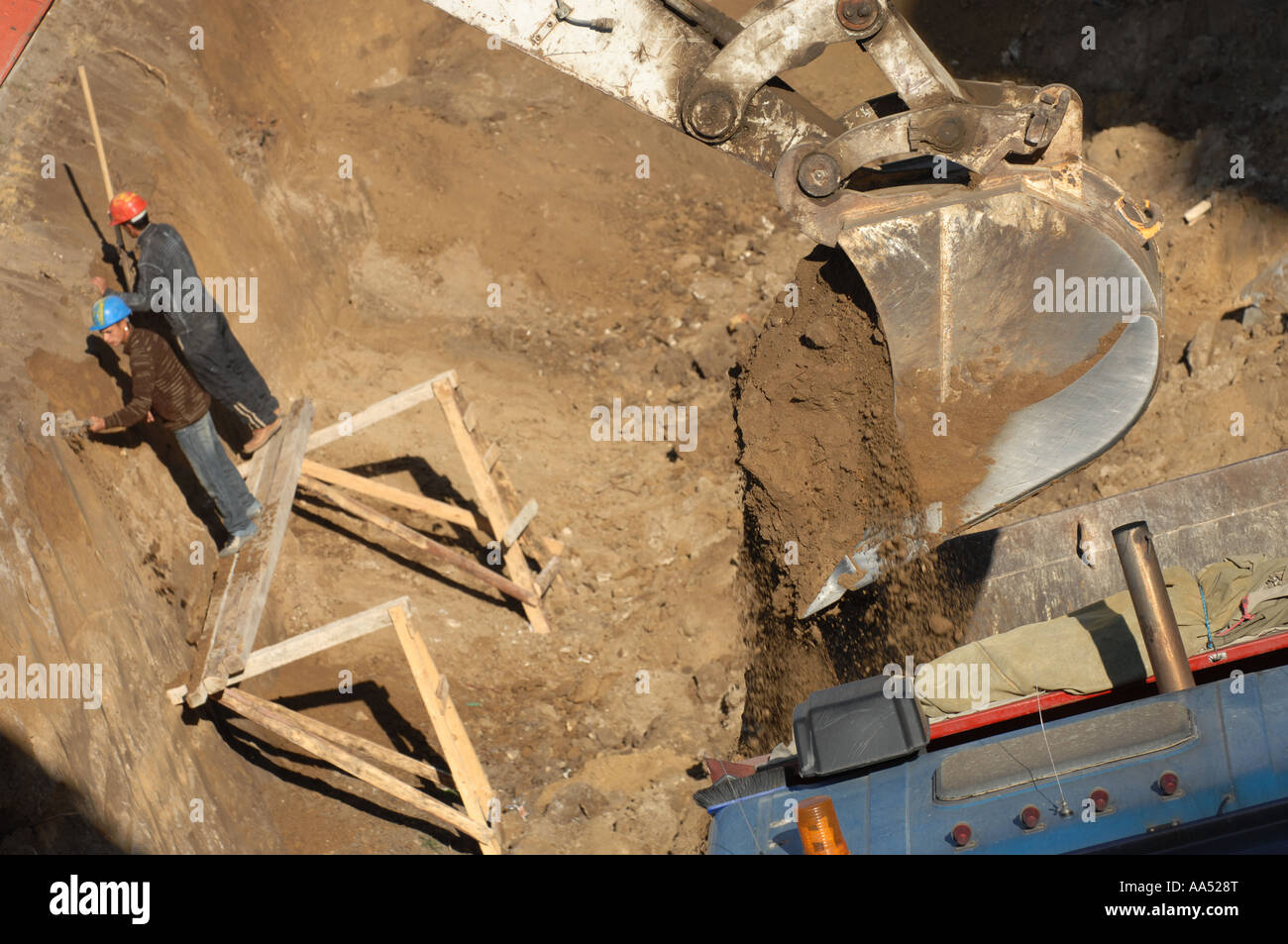 lorry and excavator Stock Photo - Alamy