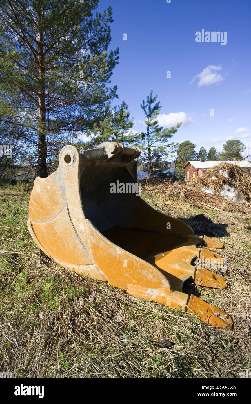 rusty digger scoop on ground Stock Photo - Alamy