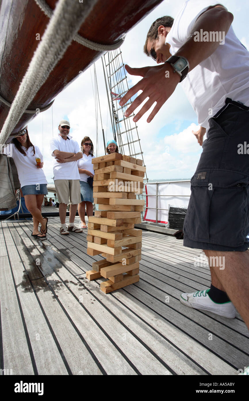People playing outdoor Jenga on deck of sailing boat Stock Photo - Alamy