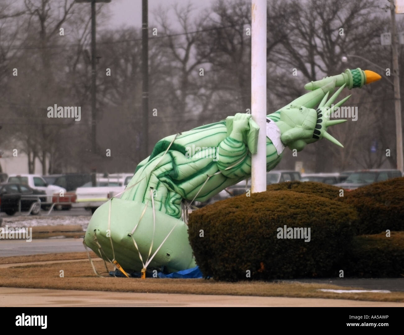 An inflatable Statue of Liberty leans backwards in the wind Stock Photo ...