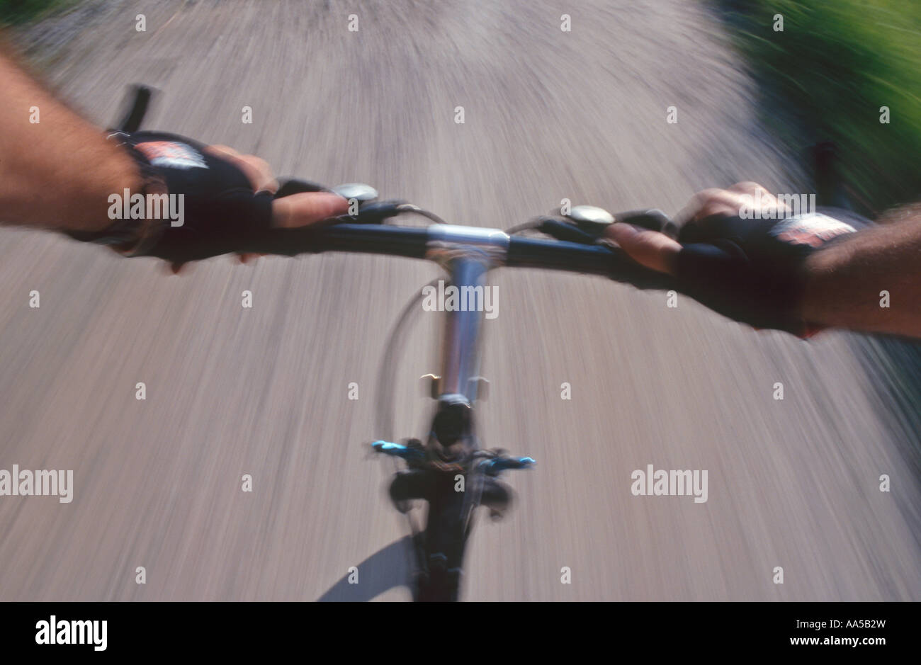 Cyclist on country path, view from handle bars Stock Photo - Alamy