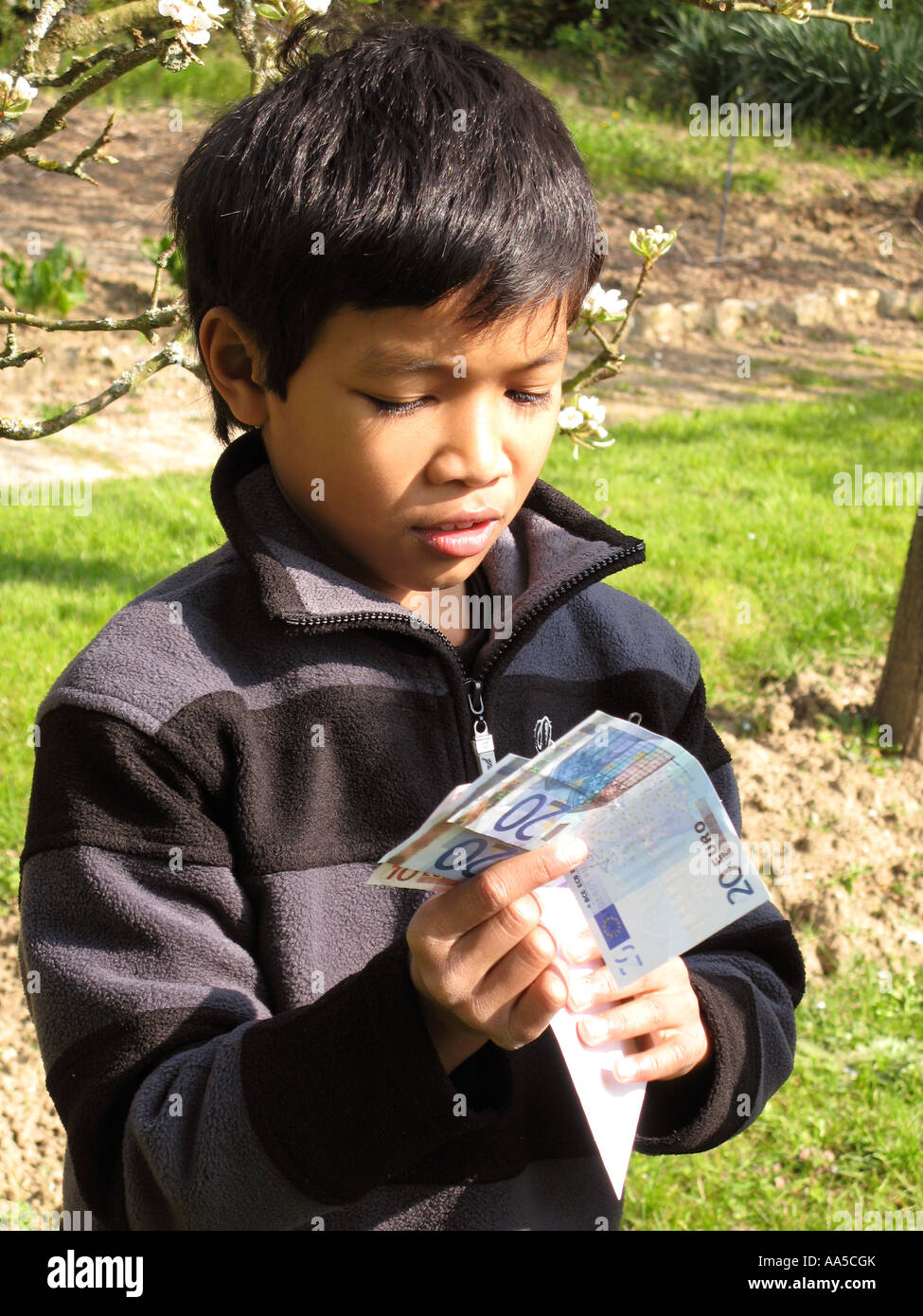 boy with money gift Stock Photo - Alamy