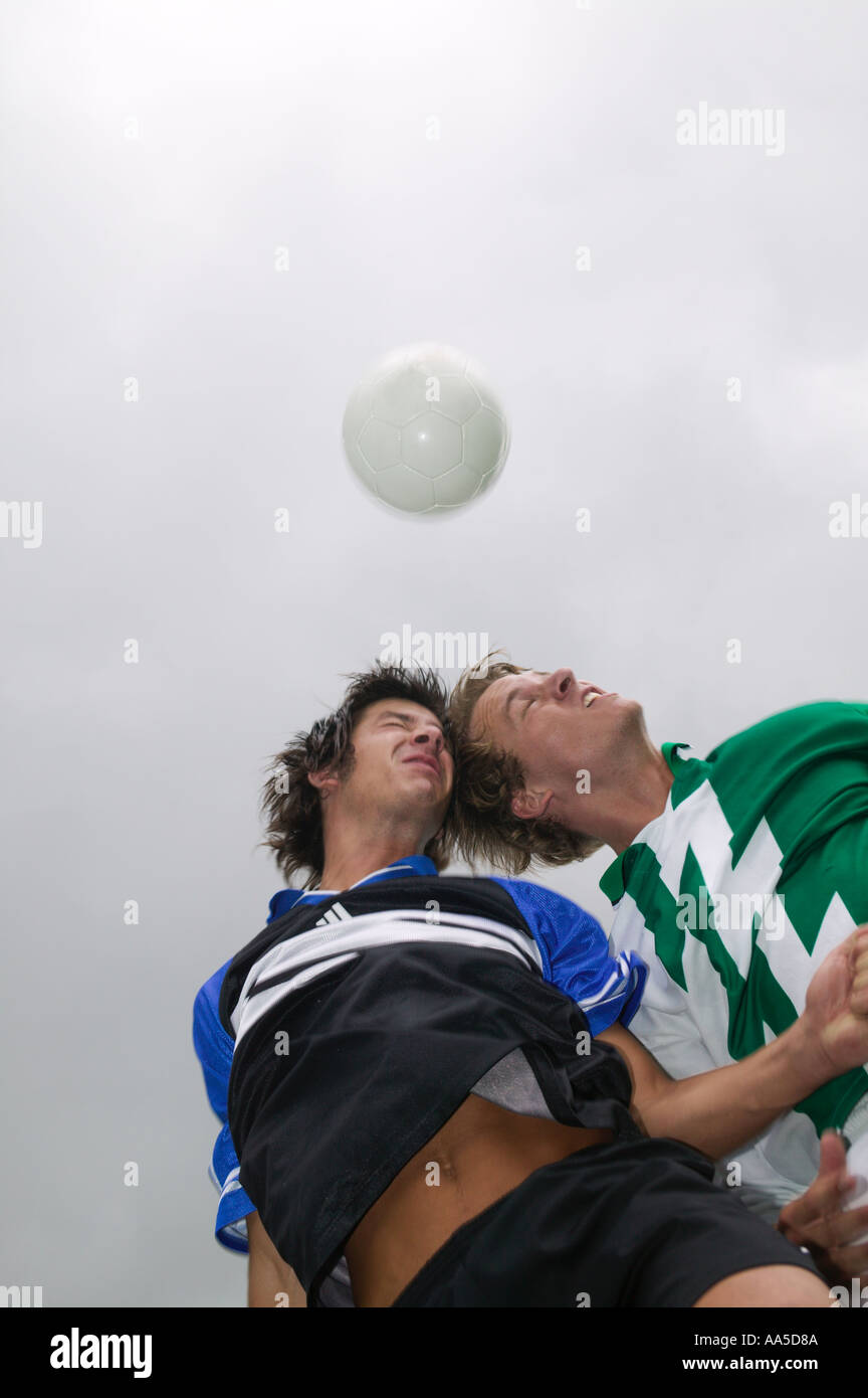 Two soccer players friends brothers with ball Stock Photo - Alamy