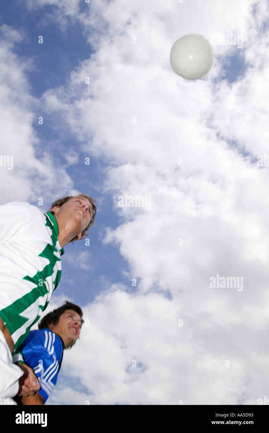 Two soccer players friends brothers with ball Stock Photo - Alamy