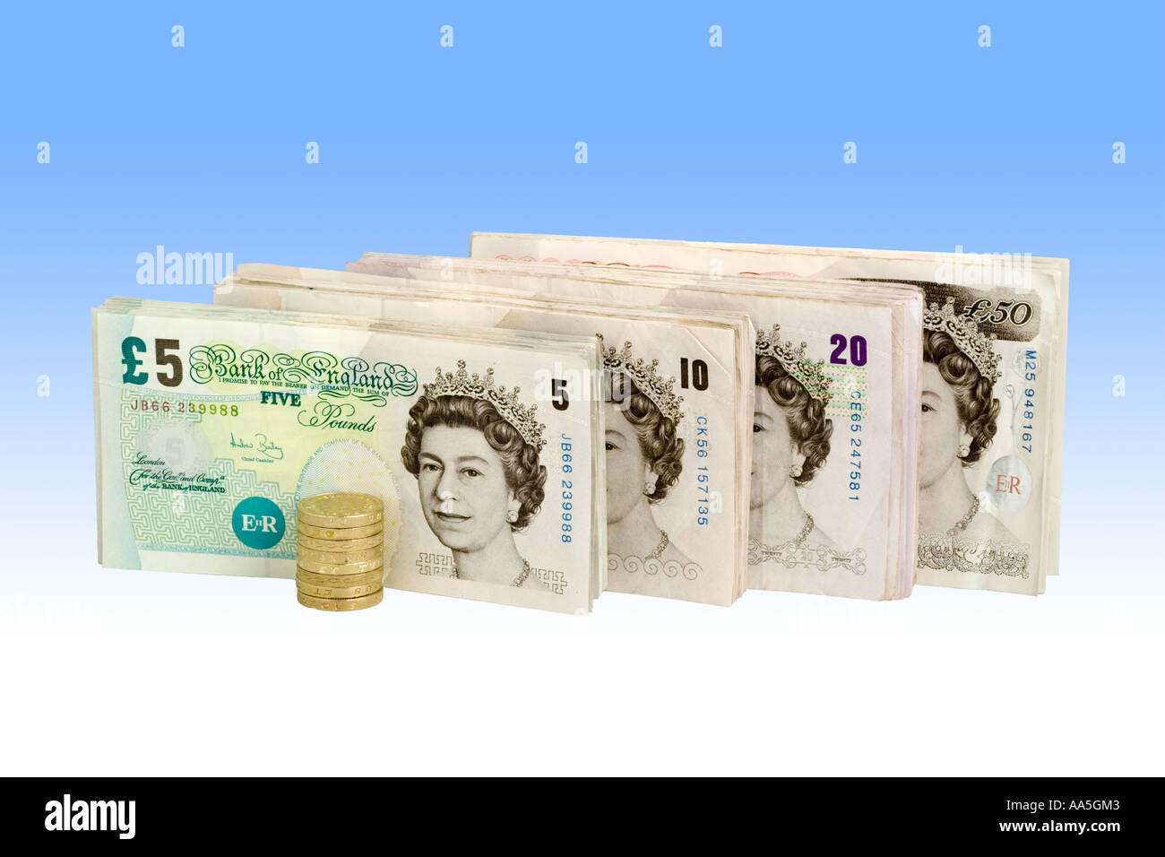 Line of UK British Bank Sterling Notes and pound coins on blue Stock ...