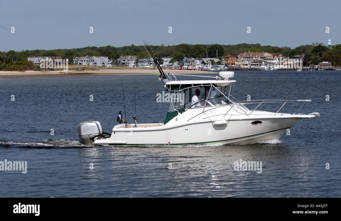 A private fishing boat headed down the Manasquan Inlet Stock Photo - Alamy