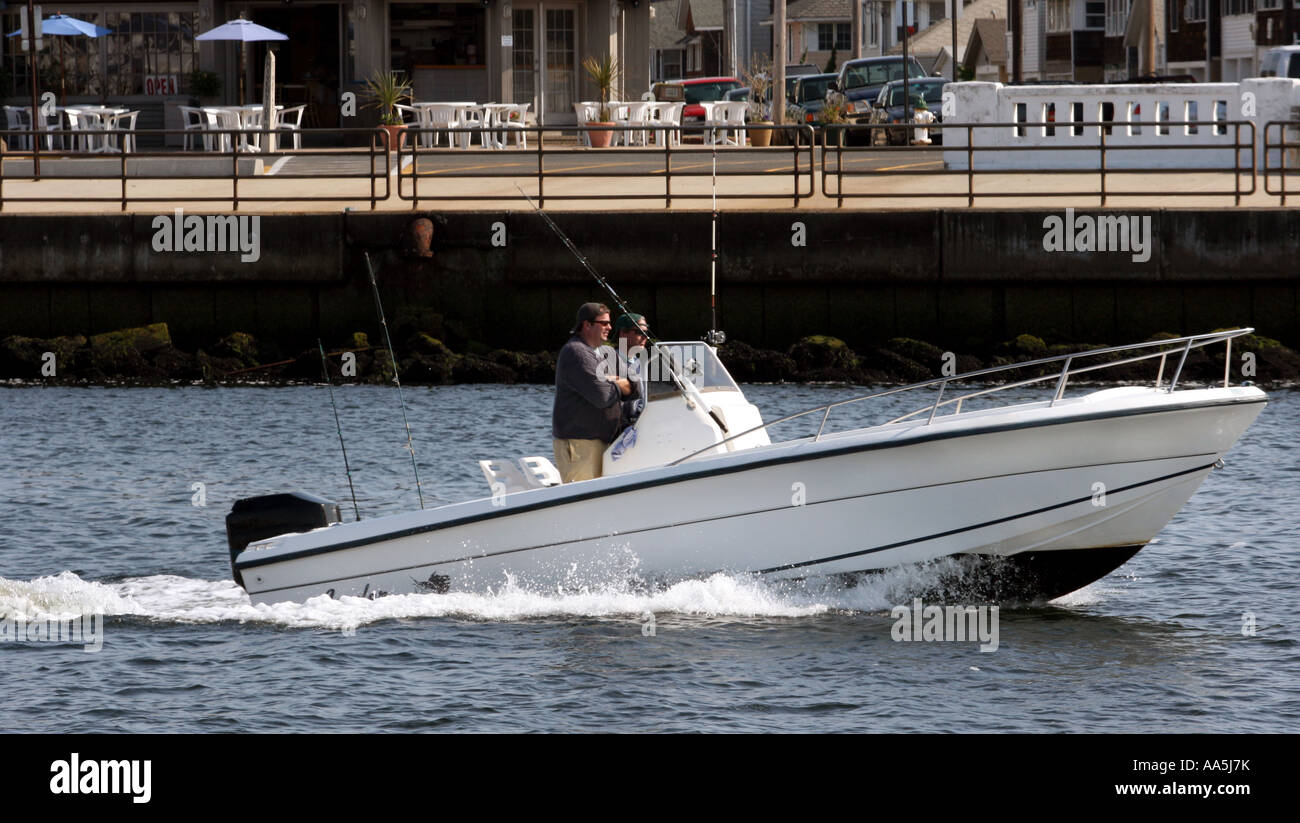 A private fishing boat headed down the Manasquan Inlet Stock Photo - Alamy