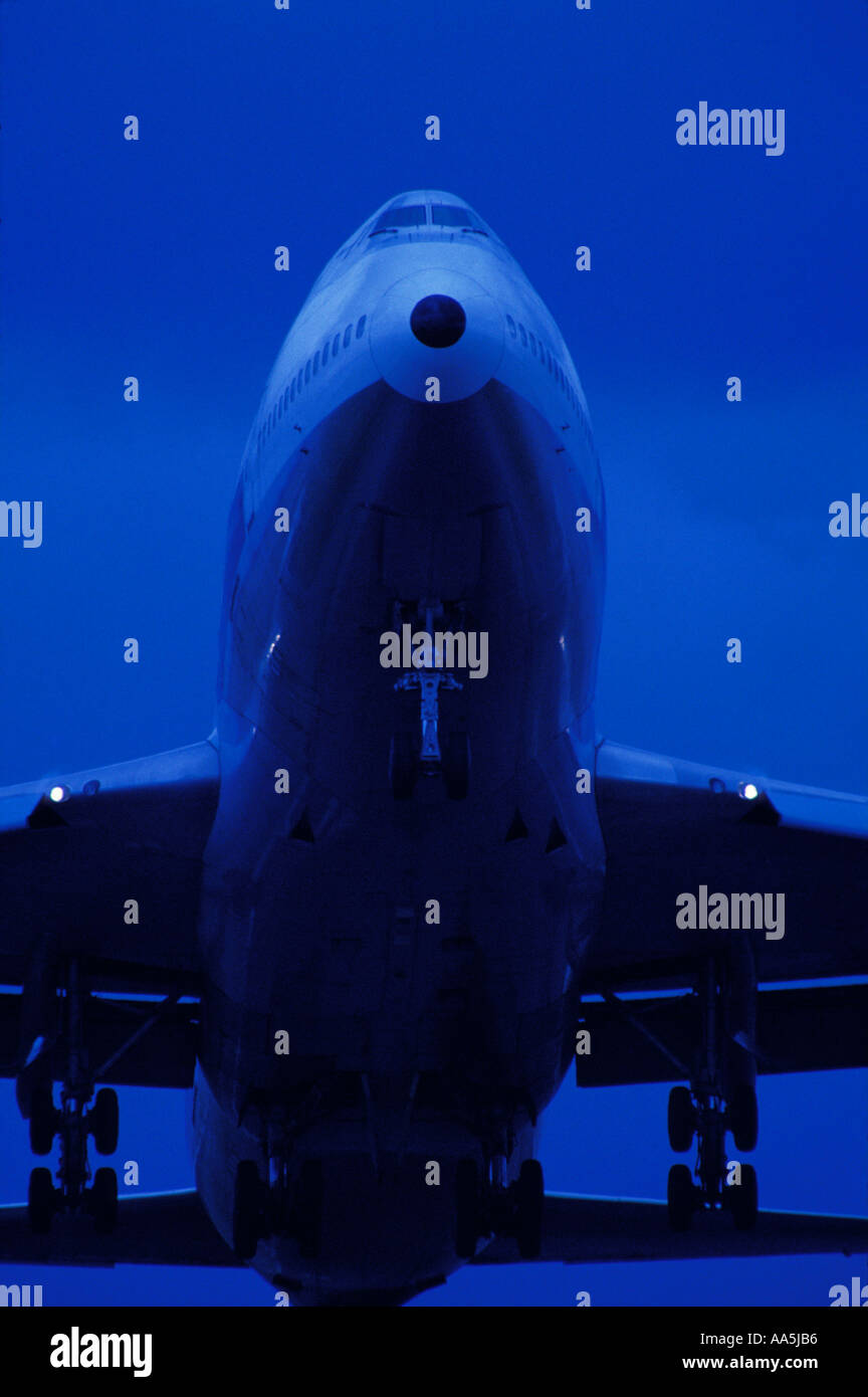A 747 takes off over the camera at night Stock Photo - Alamy