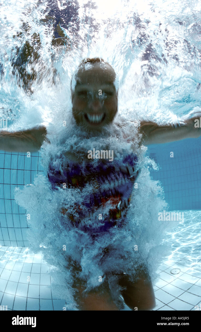 Woman jumping into pool as seen from underwater Stock Photo - Alamy