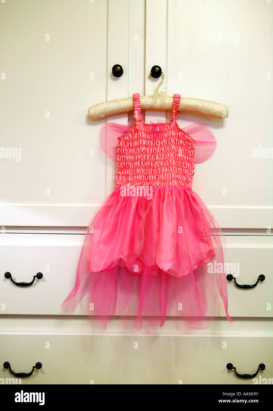 Angel wings hanging on wardrobe hi-res stock photography and images - Alamy