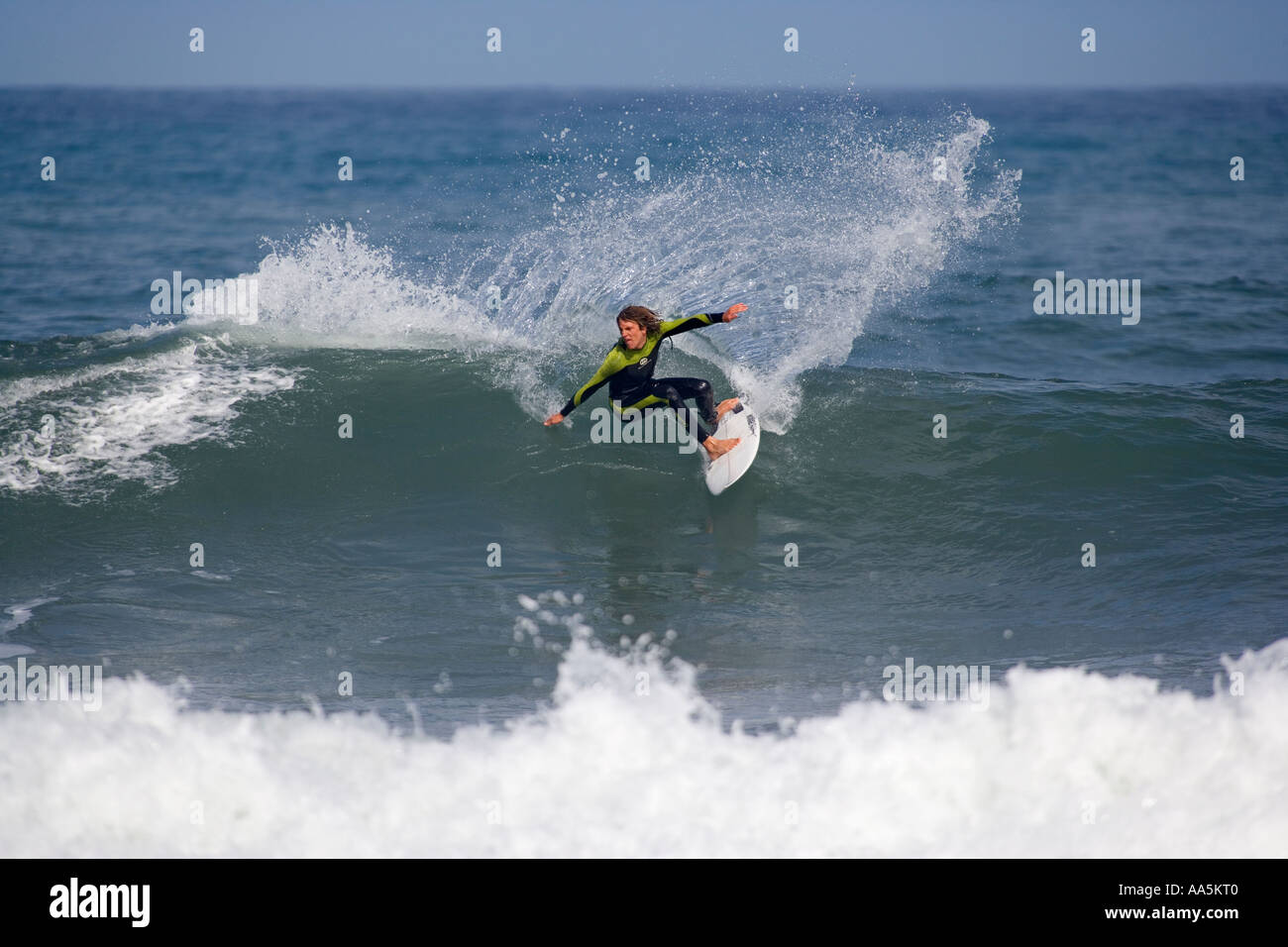 Surfer performing a huge cutback Stock Photo - Alamy