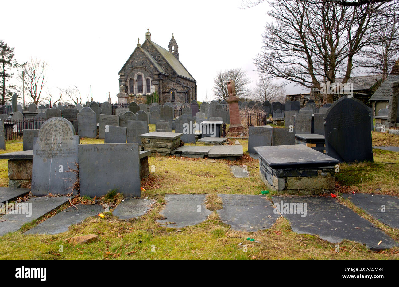 Church and graveyard with slate gravestones at Llan Ffestiniog Gwynedd ...