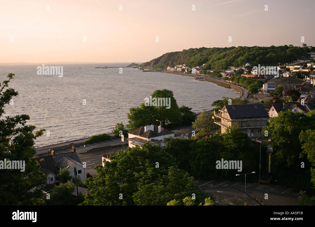 Summer sunrise over famous South Wales tourist destination Mumbles town ...