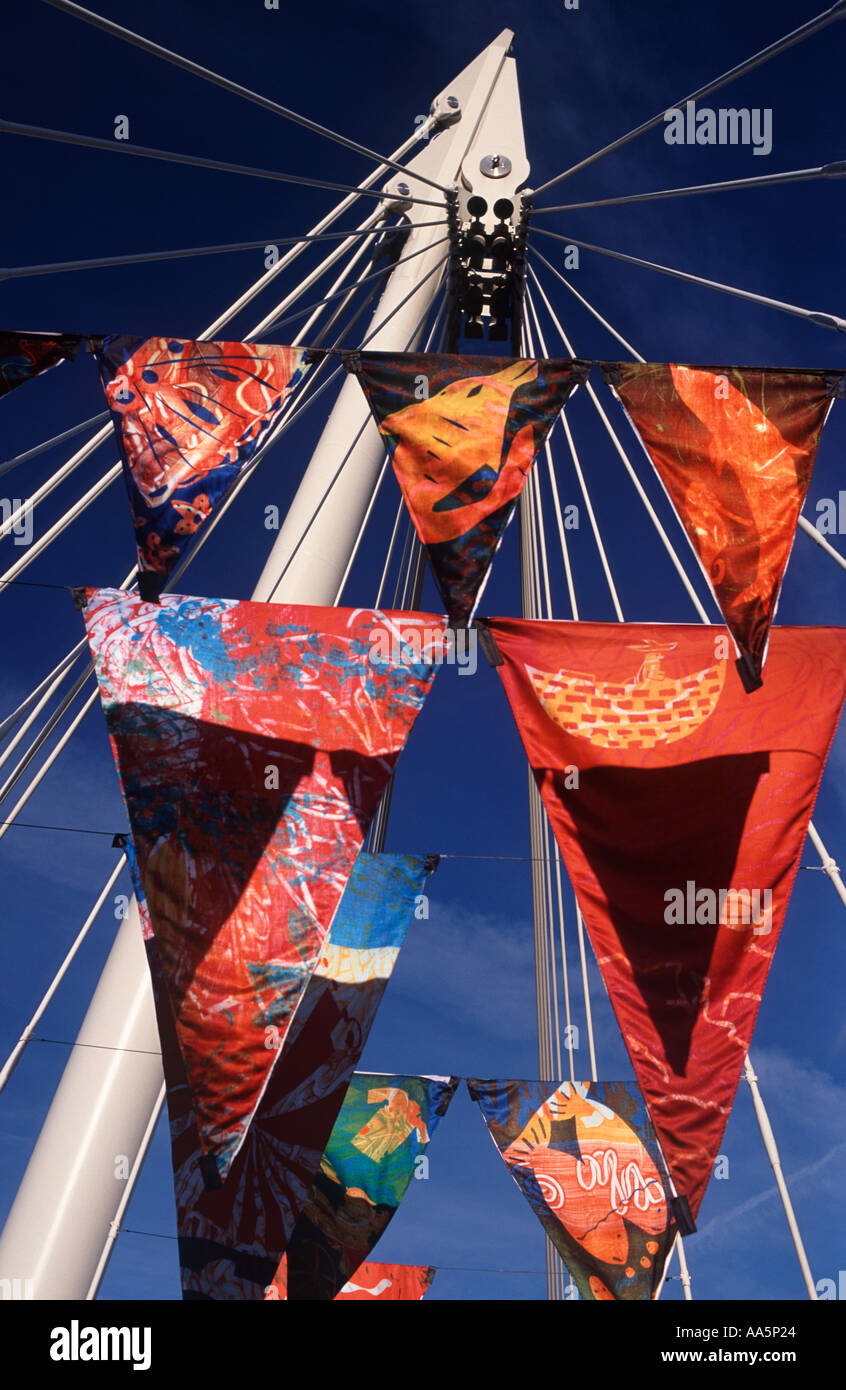 Triangular colourful flags hanging above Hungerford Bridge, with ...